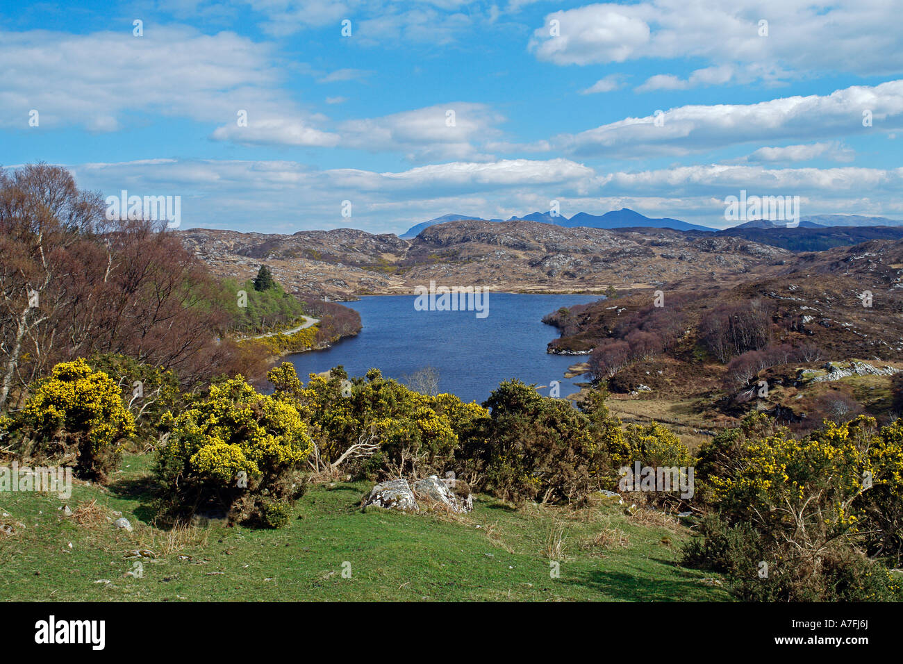Small Scottish loch in Wester Ross Scotland with a view to distant ...