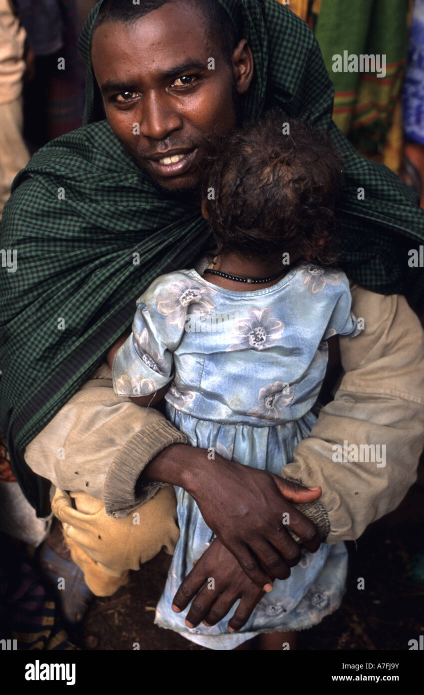 Africa, Ethiopia Fantalle Father with sick daughter Stock Photo - Alamy