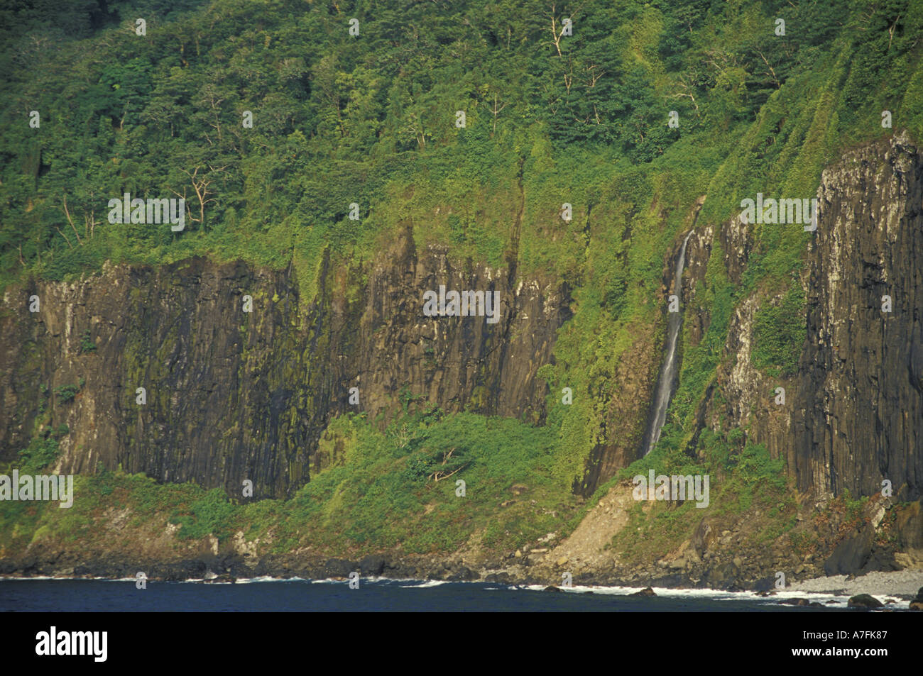 CA, Costa Rica, Cocos Island. Waterfall at island coastline Stock Photo ...