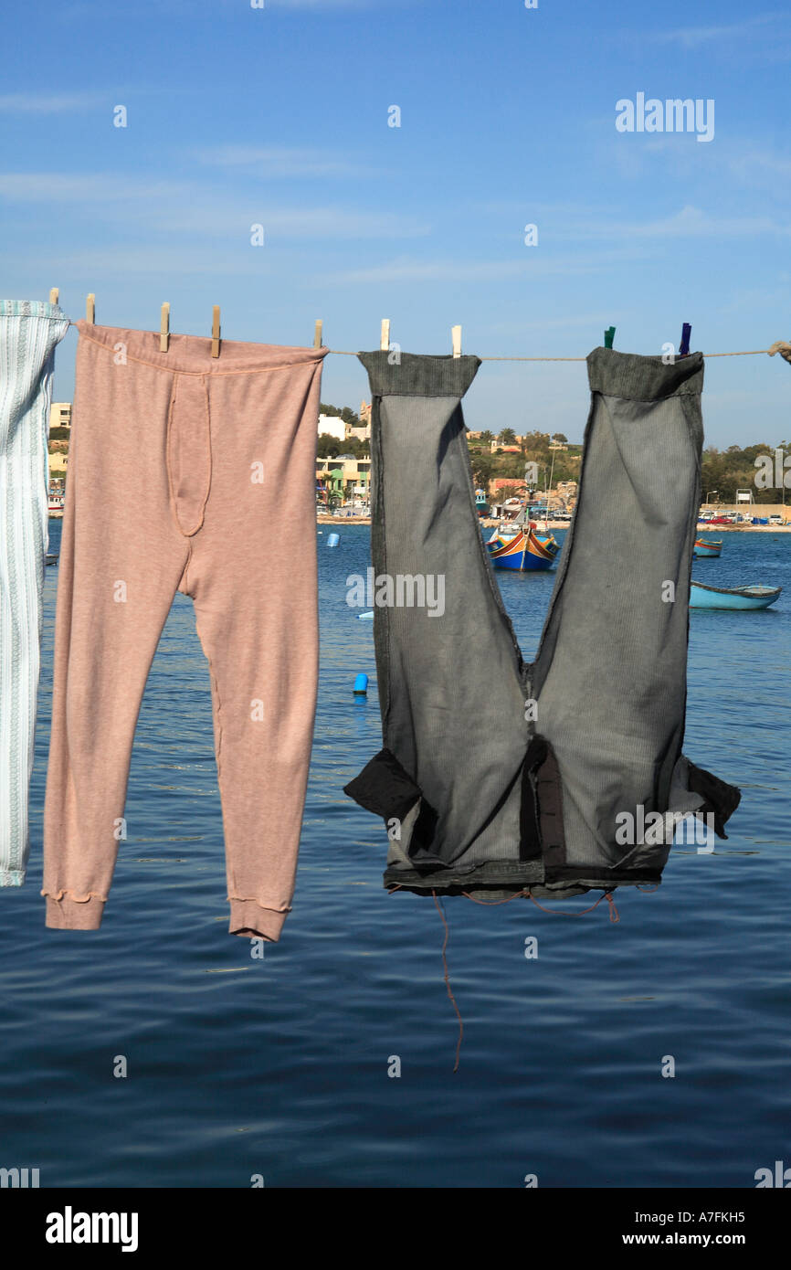 Washing line in Marsaxlokk Malta Stock Photo - Alamy