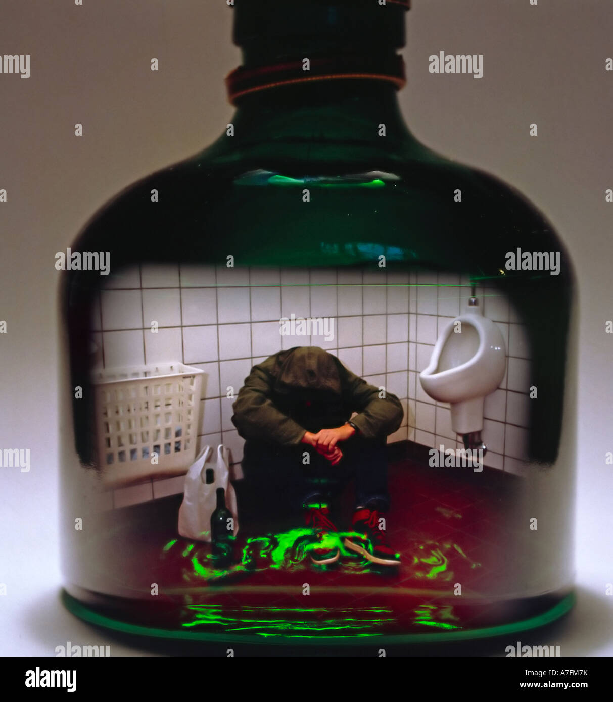 MR scene in a bottle alcoholic in a drunken stupor sitting on the floor ...