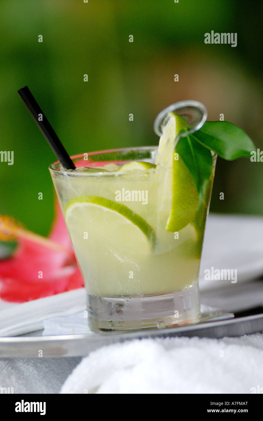 lemon drink on silver tray with lime and straw Stock Photo - Alamy