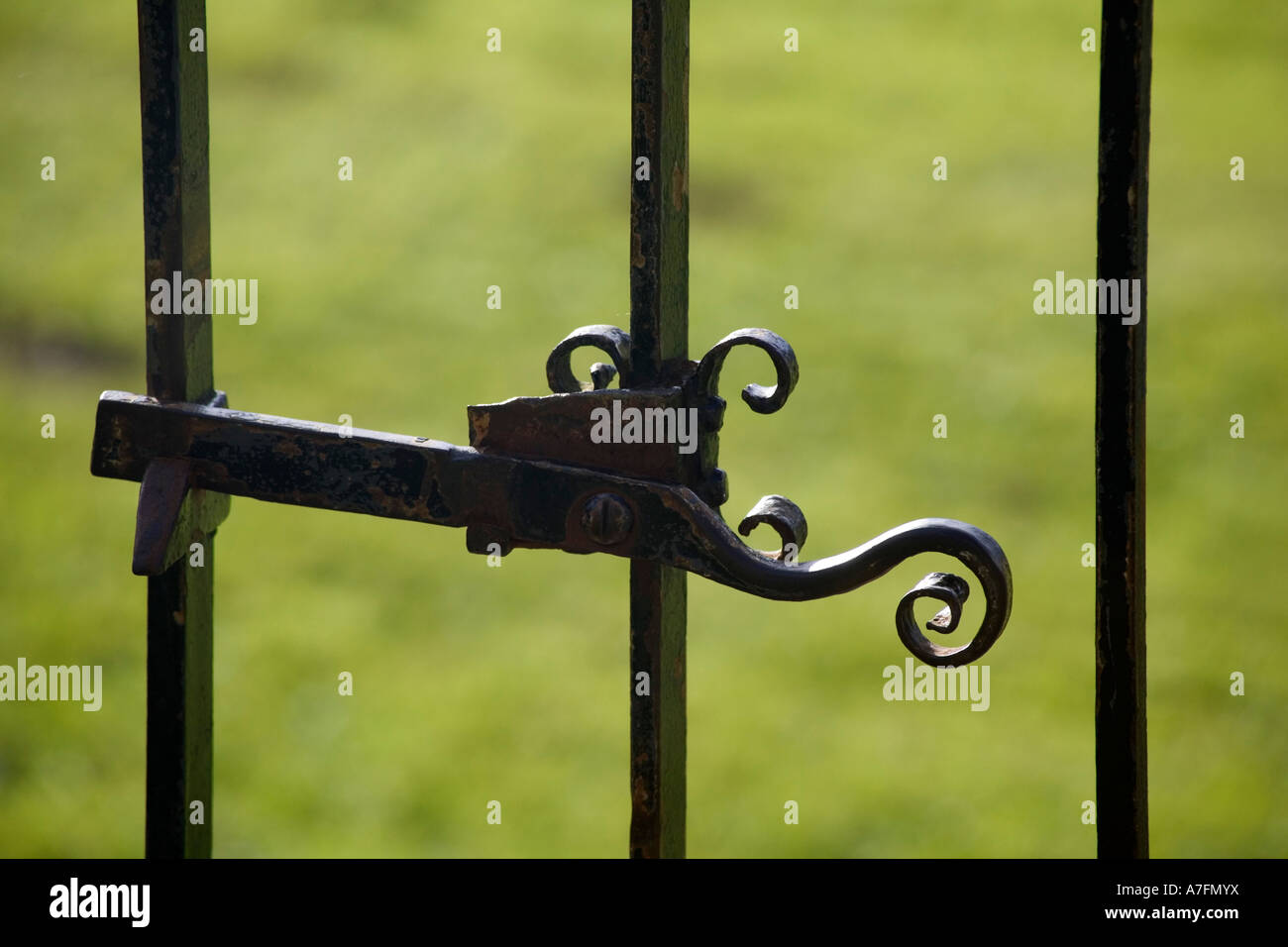 Latch latch on gate in shape of a pistol Stock Photo - Alamy