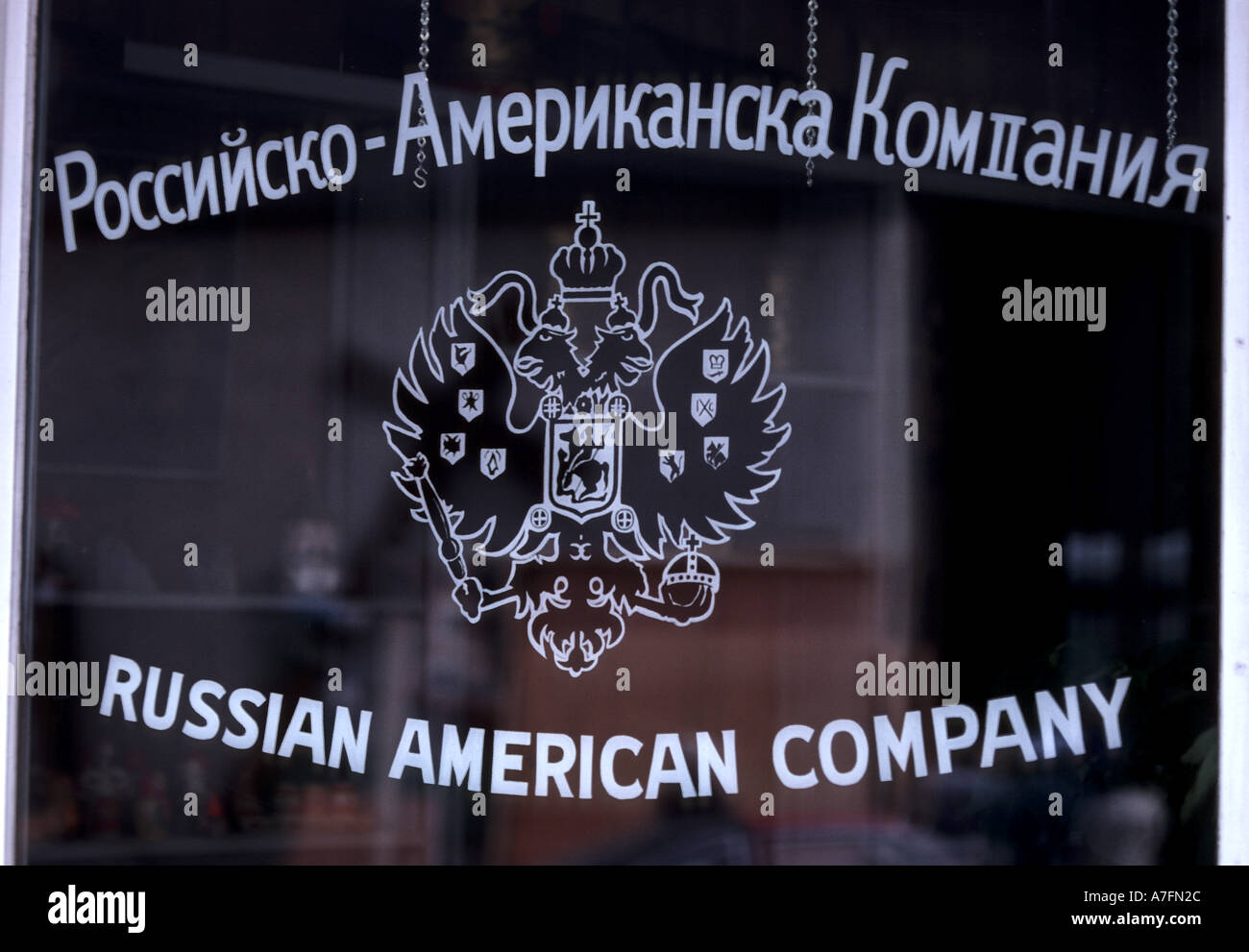 U.S.A., Alaska, Sitka Store window with bilingual sign Stock Photo - Alamy