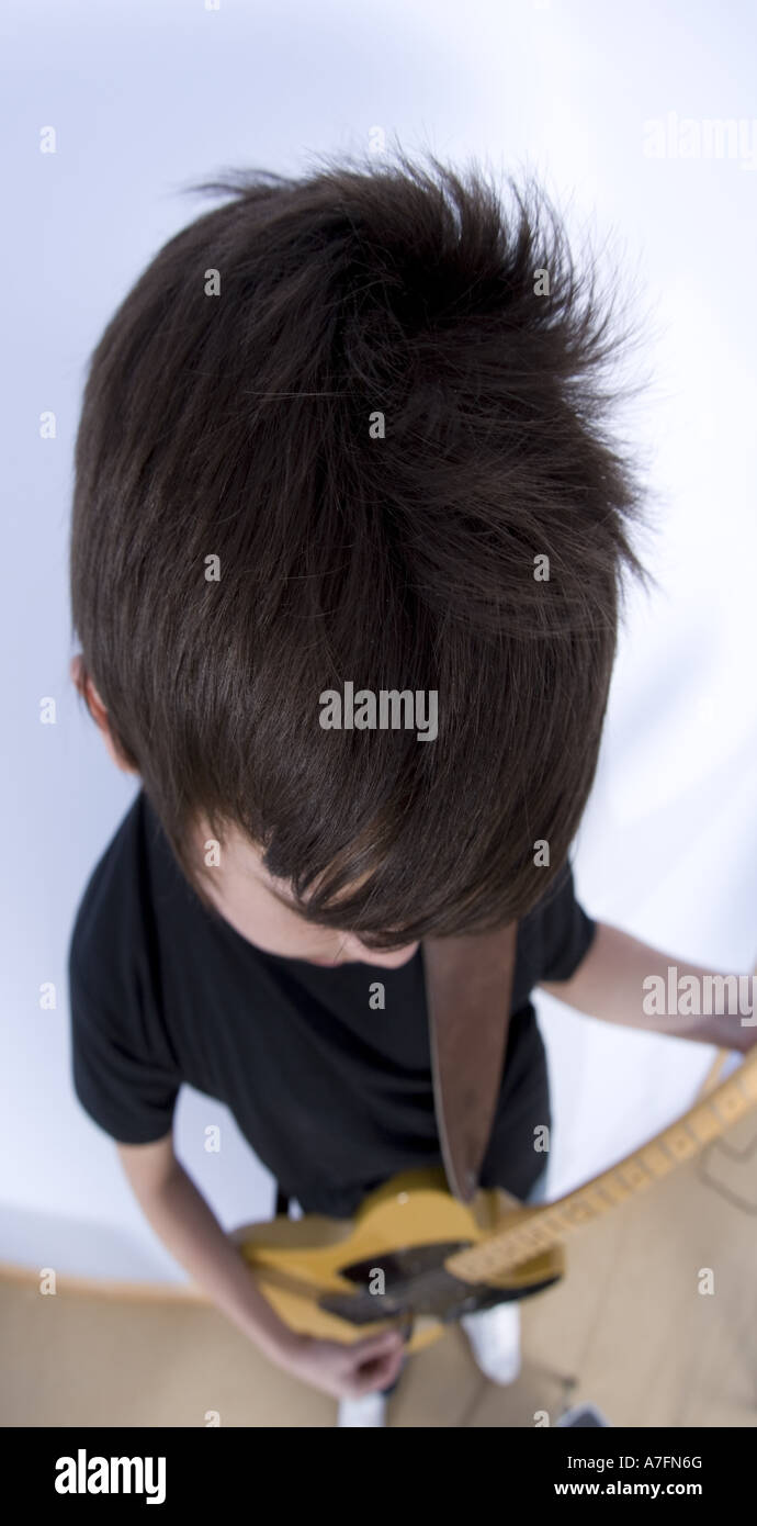 14 year old teenage boy playing punk rock on a vintage blonde fender ...