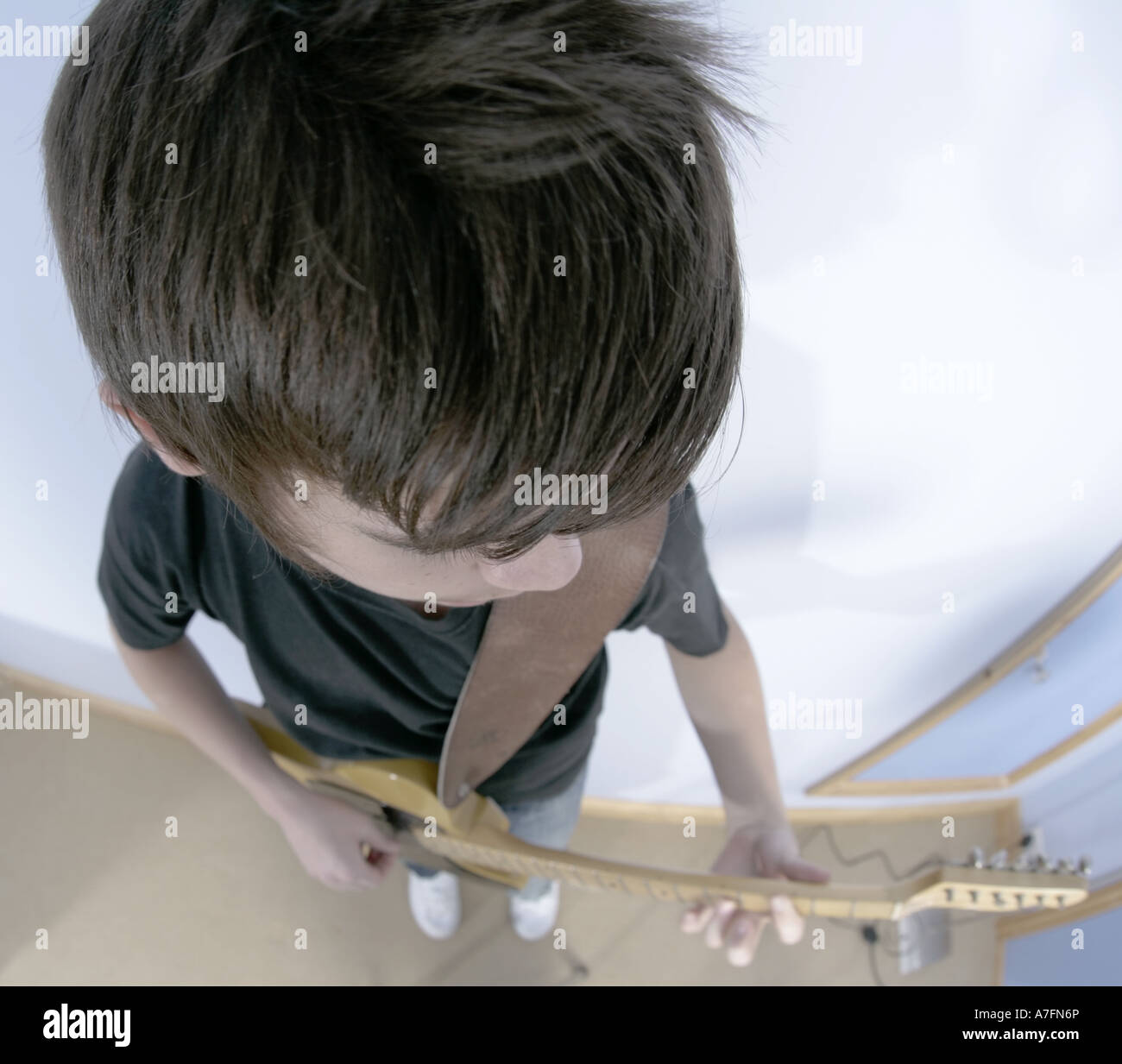 14 year old teenage boy playing punk rock on a vintage blonde fender ...