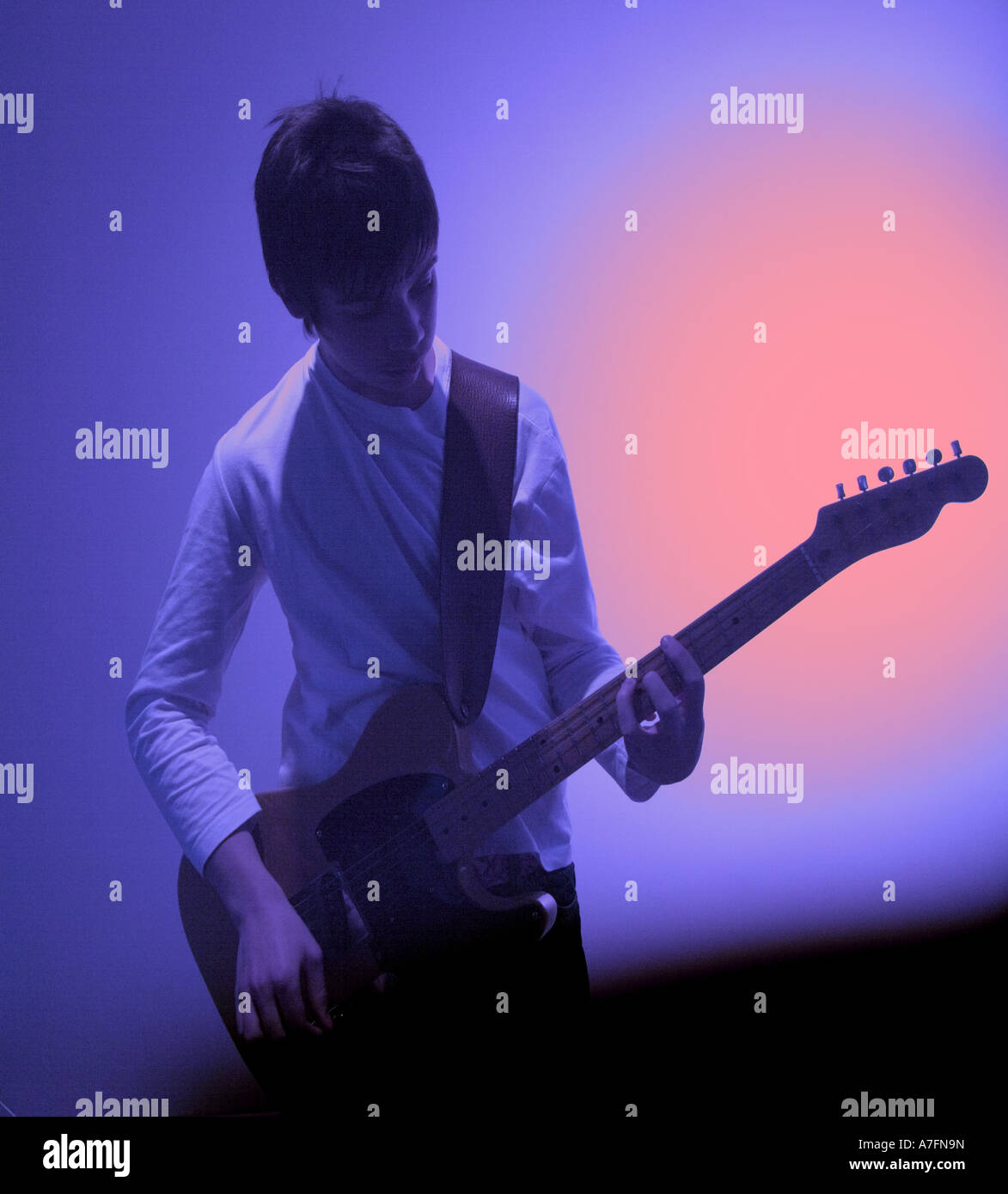 14 year old teenage boy playing punk rock on a vintage blonde fender ...