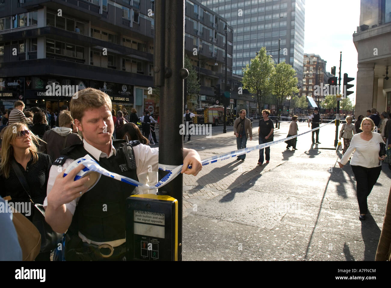 Police tying cordon on Oxford Street, London Stock Photo - Alamy