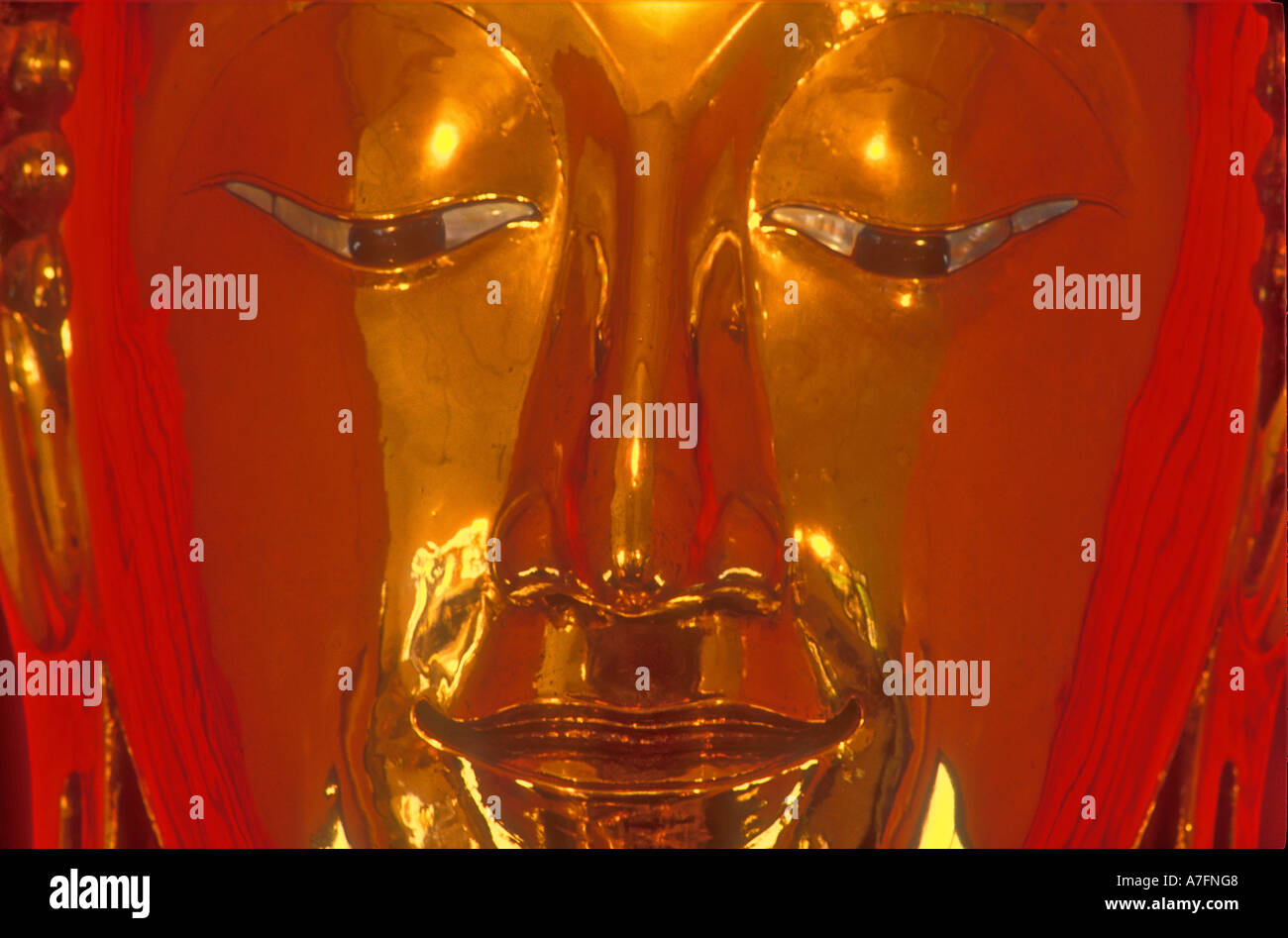 Face of the solid gold statue of Buddha at Wat Trimitr in Bangkok ...