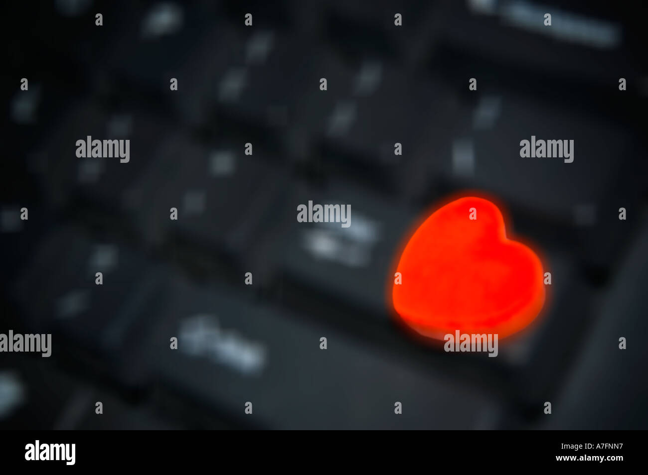 Keyboard with heart on return key Stock Photo - Alamy