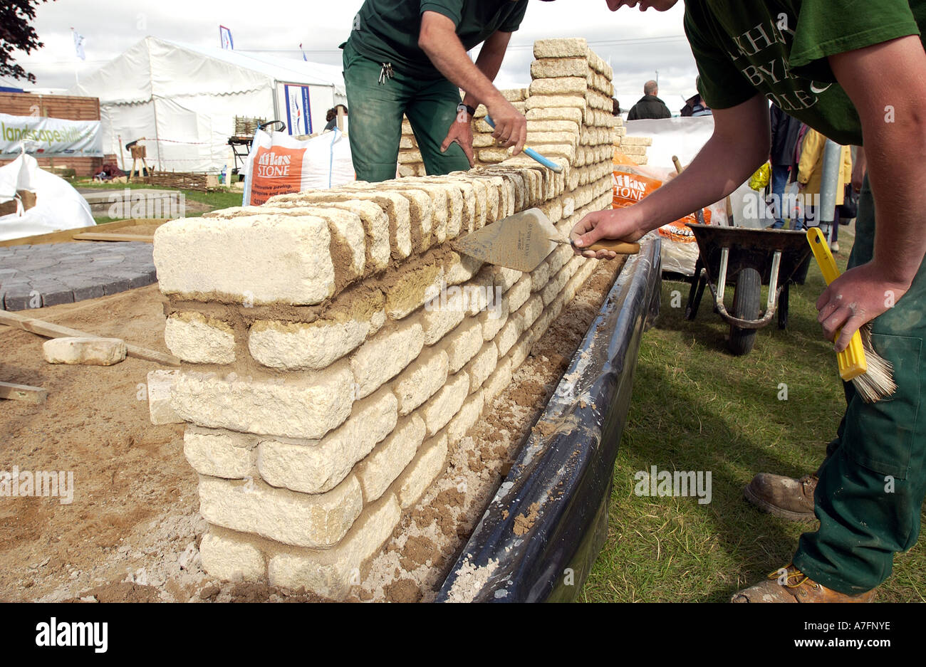 Stone wall building Stock Photo - Alamy