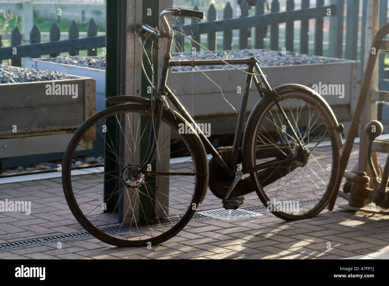 rusty old broken bicycle on train station platform Stock Photo - Alamy