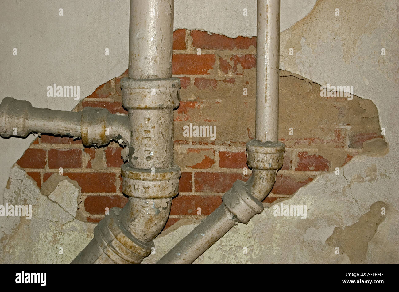 Old iron pipes in brick building Stock Photo - Alamy