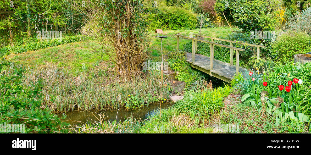 bridge over stream in garden Stock Photo - Alamy