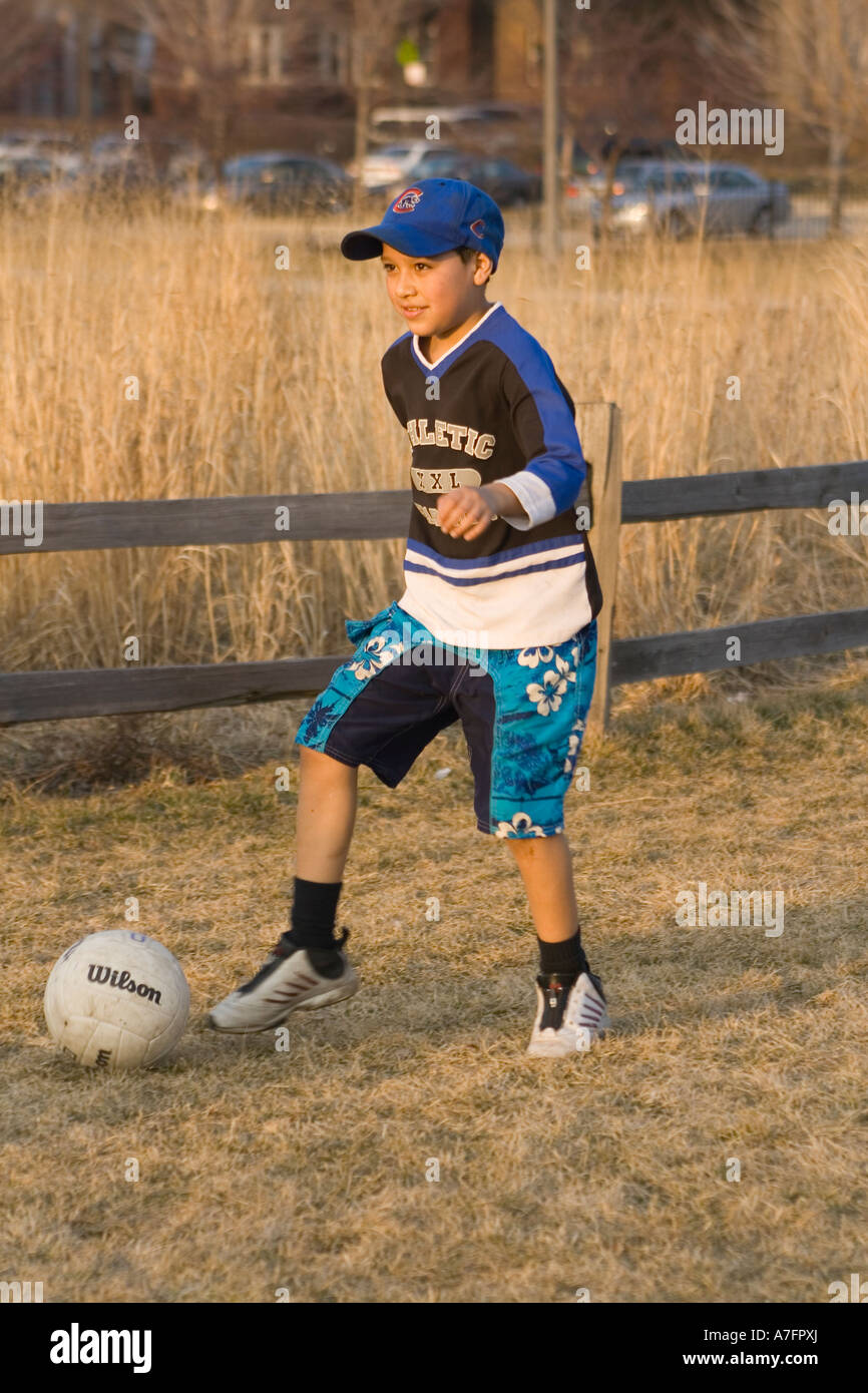 Hispanic boy playing soccer in Winnemac park, Chicago, IL Stock Photo ...