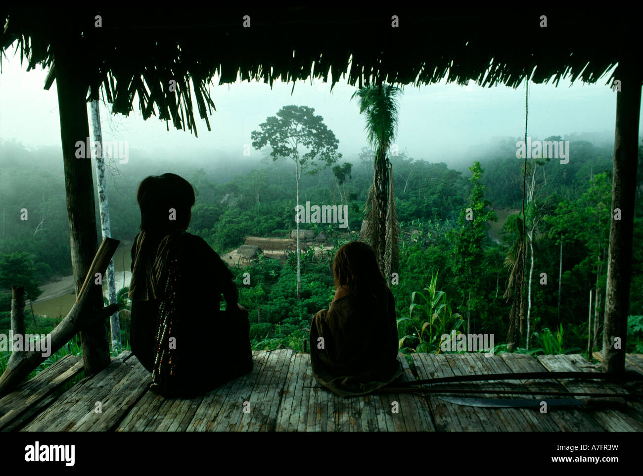 Children look across the village on the river Breu Stock Photo - Alamy