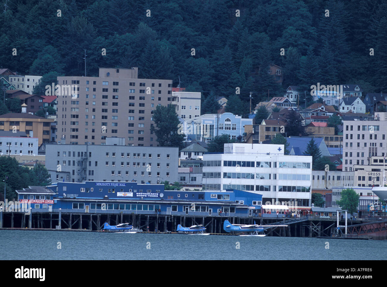 NA, USA, Alaska, Juneau, A float plane takes off from the Juneau harbor ...