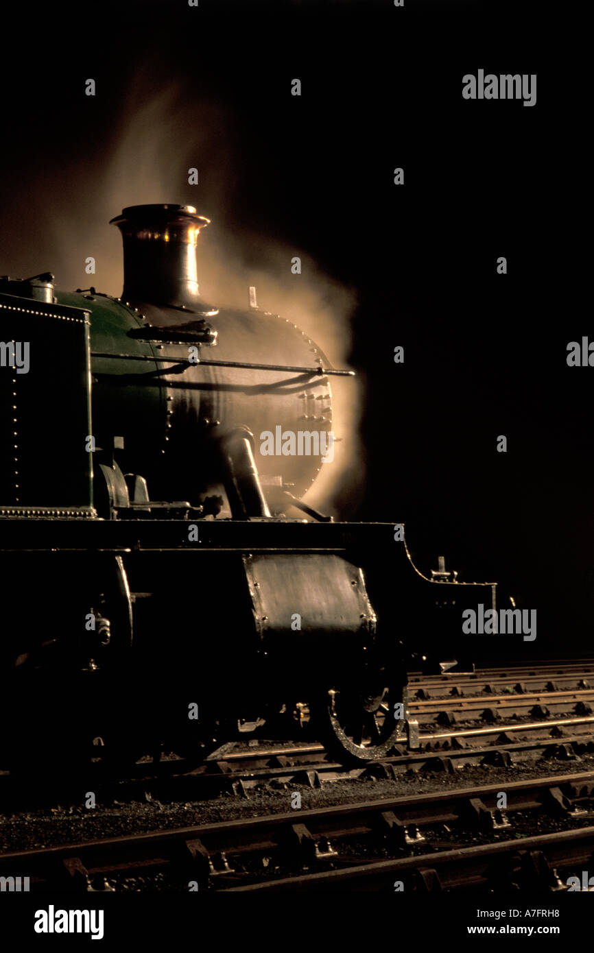 Night shot of a steam locomotive in steam at didcot depot in swindon ...