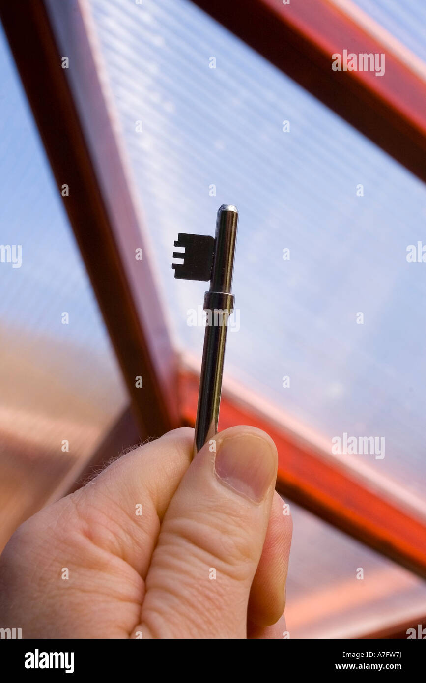 hand holding up key Stock Photo - Alamy