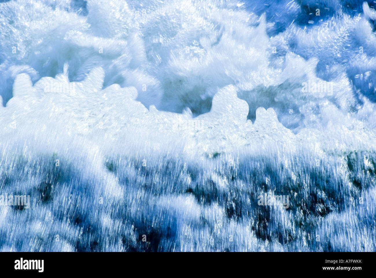 water rushing over weir Stock Photo - Alamy