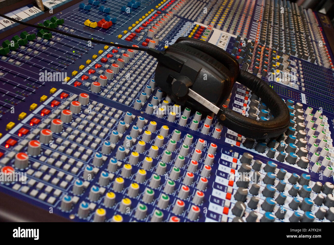 Close up of an audio visual mixing desk complete with headphones Stock ...