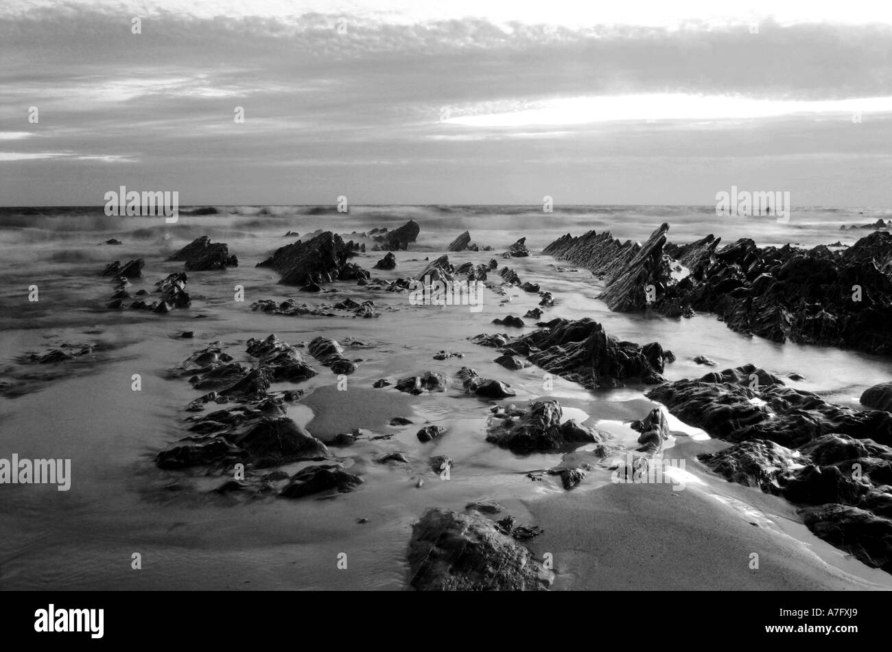 Ebb sea on coast Black and White Stock Photos & Images - Alamy