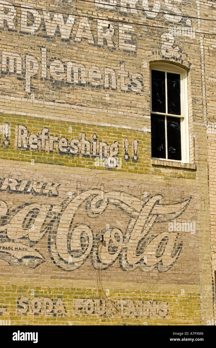 Old ads painted on side of brick bulding downtown Stock Photo - Alamy