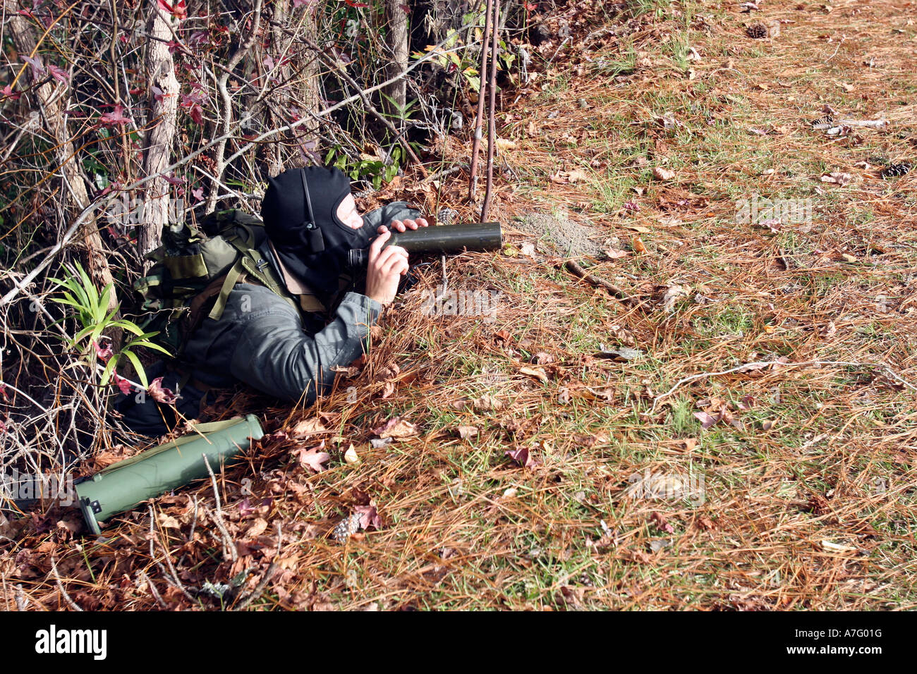 A marksman observer with the Provost Marshal’s Office, relays ...