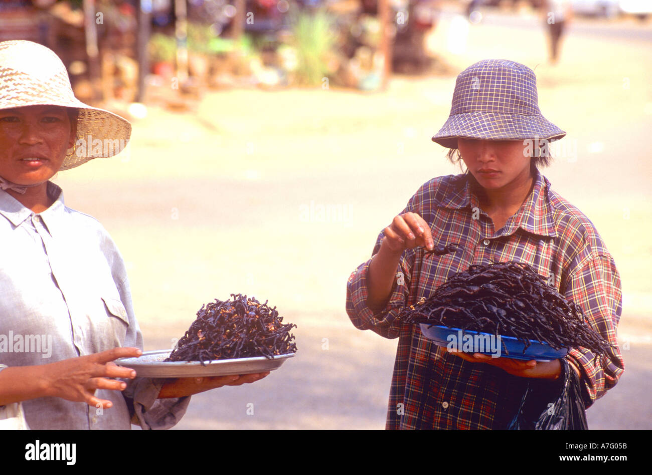Vendors with trays of beer snack fried spiders Cambodia Stock Photo - Alamy