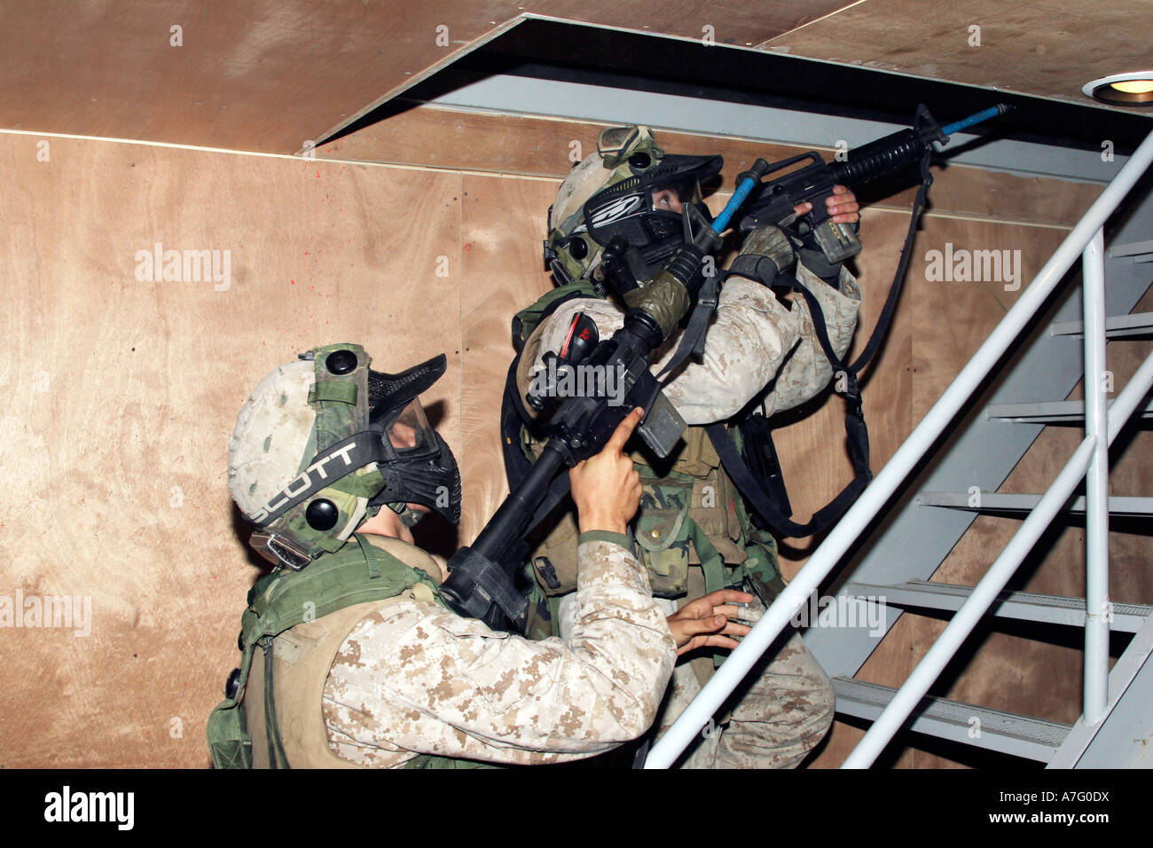 Infantry scouts go up a flight of stairs, moments away from a ...
