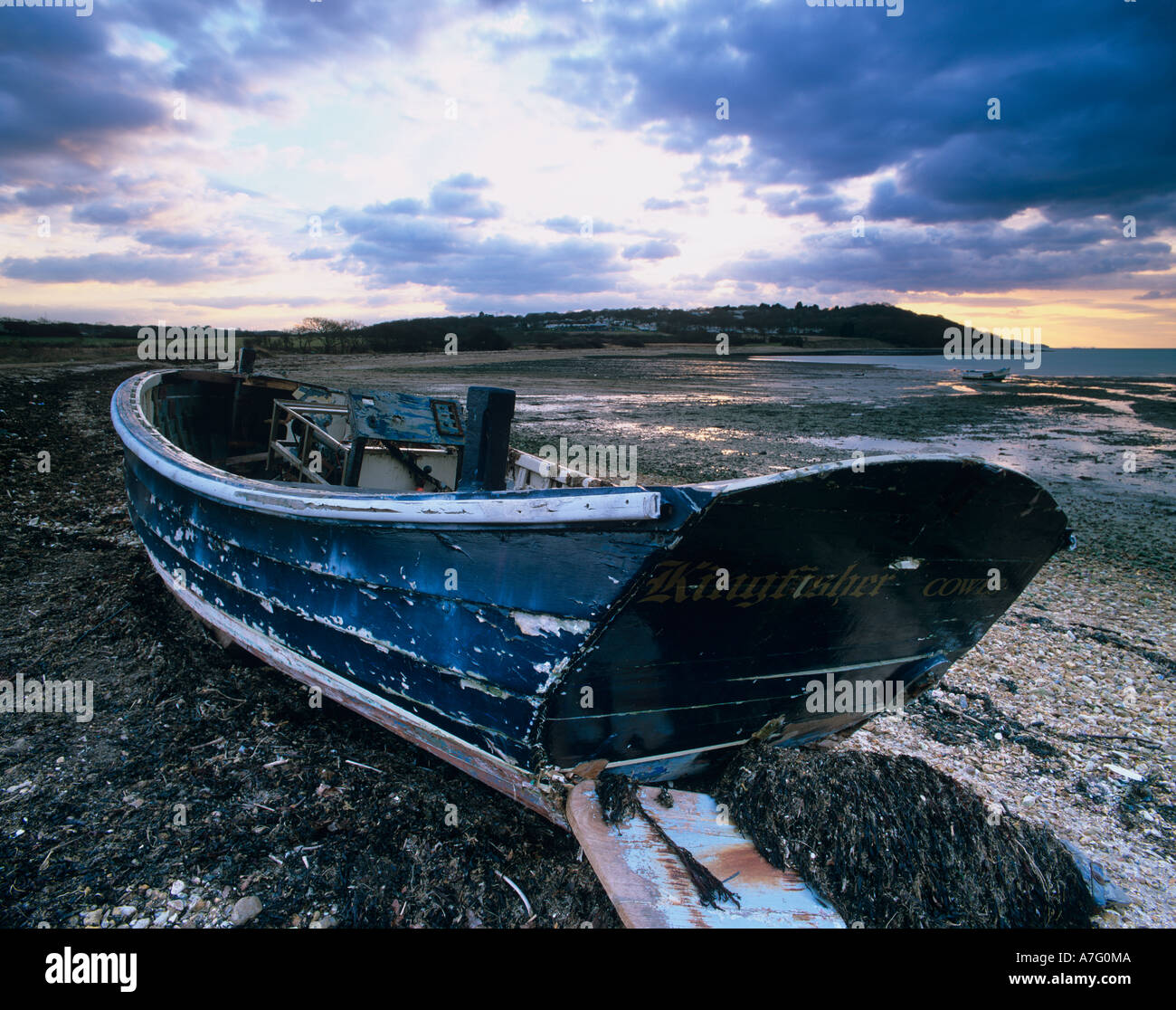 atmospheric image of a Wreck of old boat on the beach high and dry ...