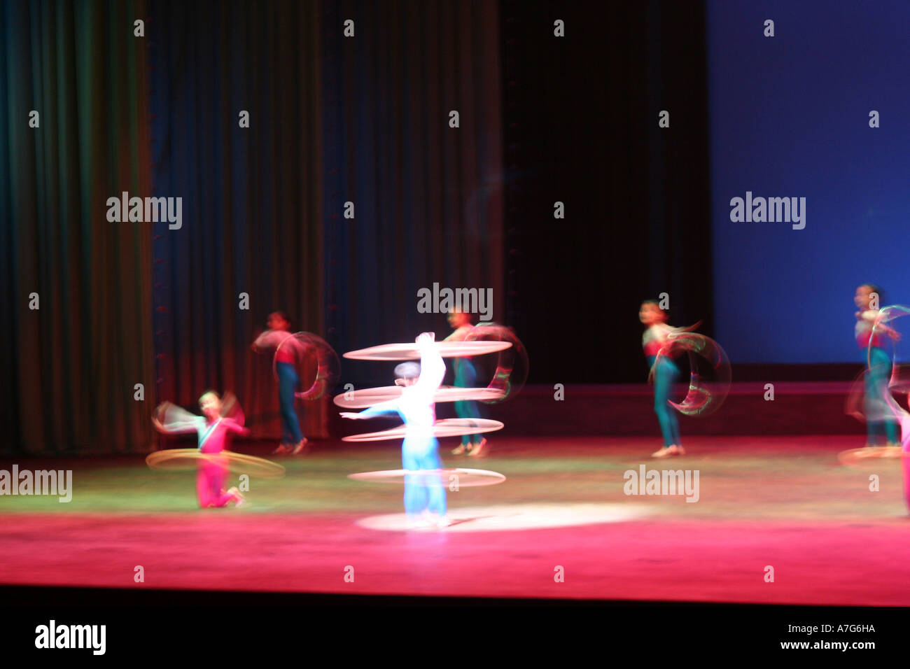 North Korean schoolchildren dance on the stage as part of a show for ...
