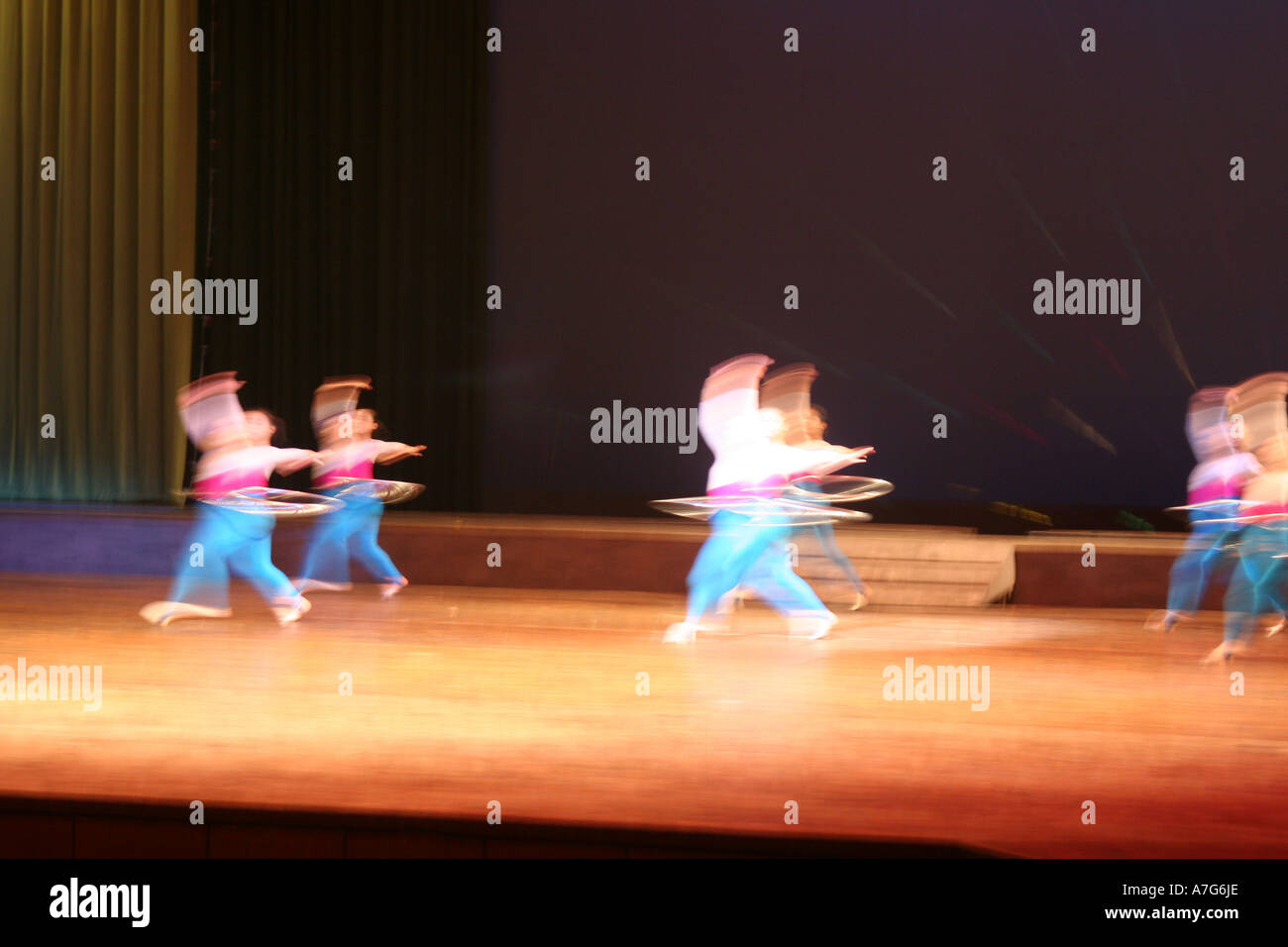 North Korean schoolchildren dance on the stage as part of a show for ...
