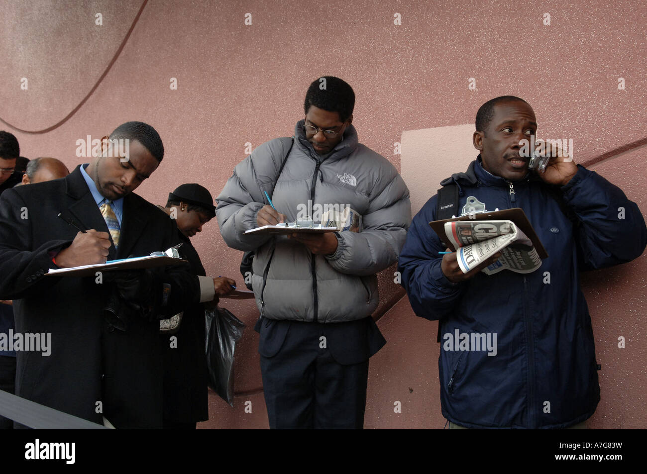 Potential employees queue up at job fair Stock Photo - Alamy