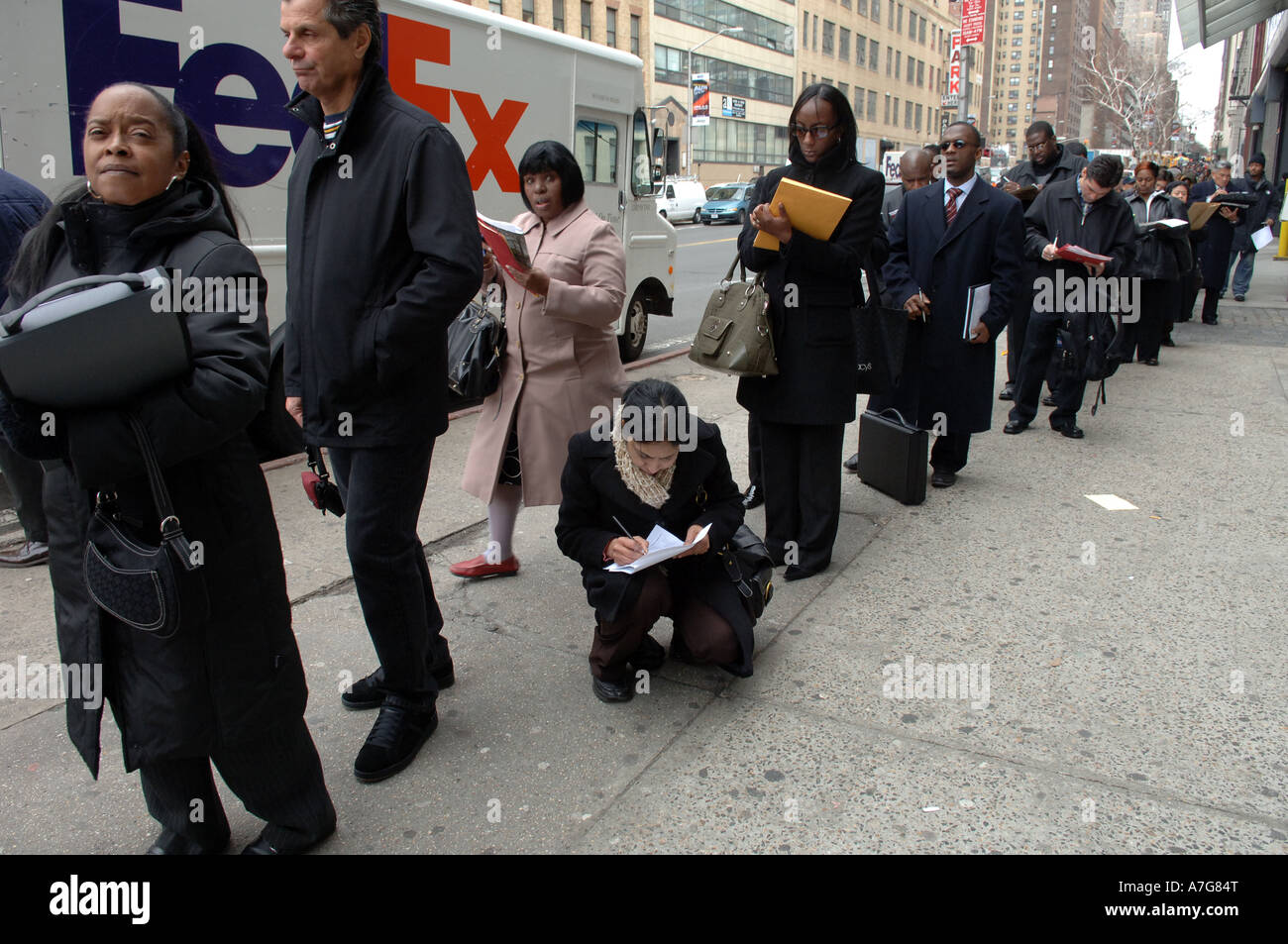 Potential employees queue up at job fair Stock Photo - Alamy