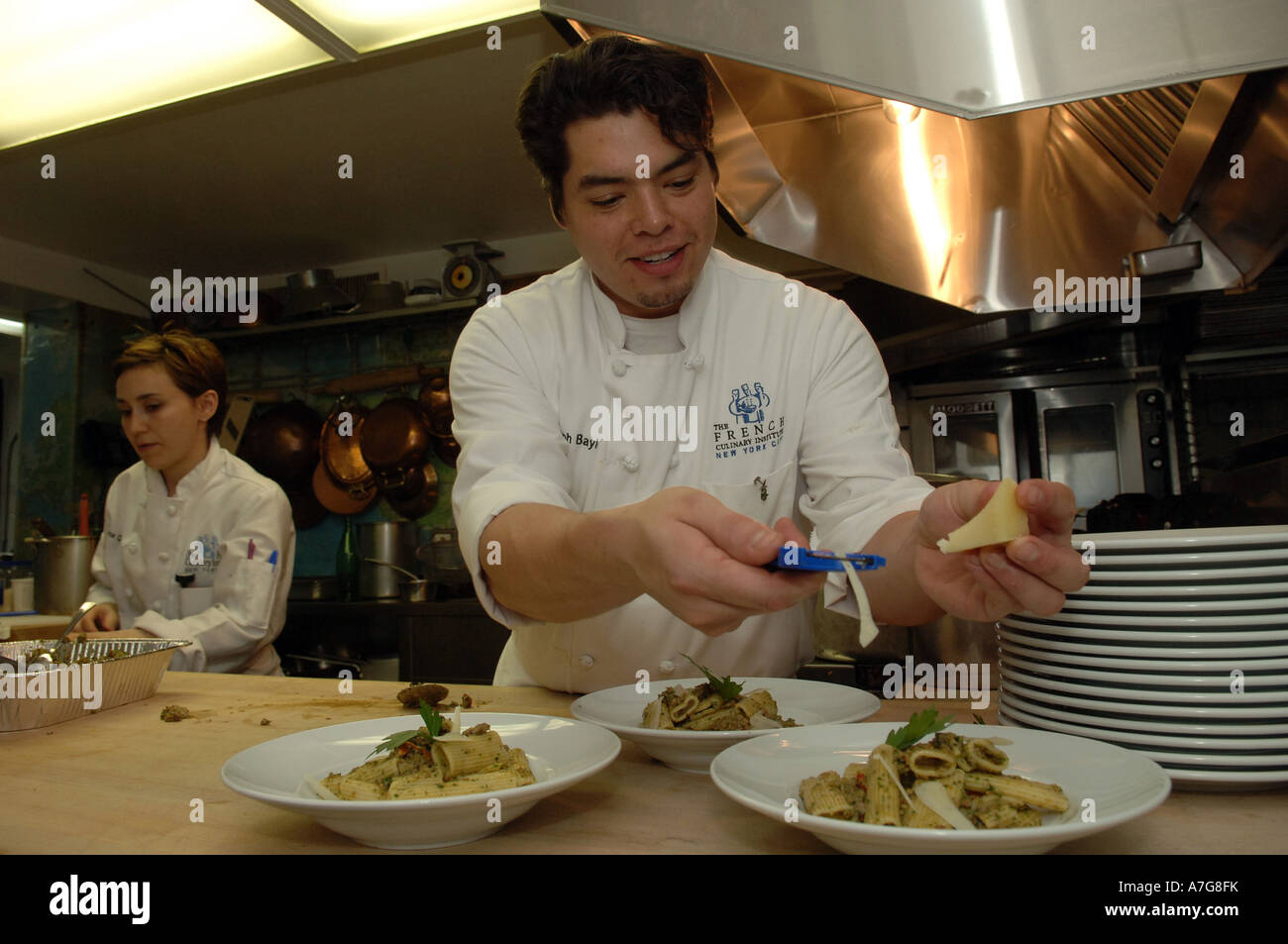 Chef from the French Culinary Institute prepares plate of pasta and ...