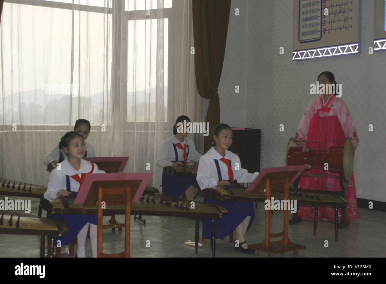 Young North Korean girls playing traditional instruments at the ...