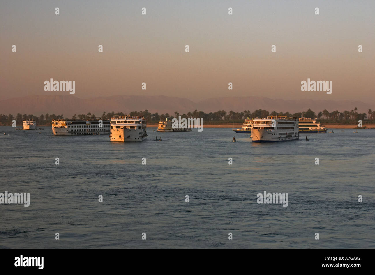 Nile River cruise ships waiting at Esna Lock Stock Photo - Alamy