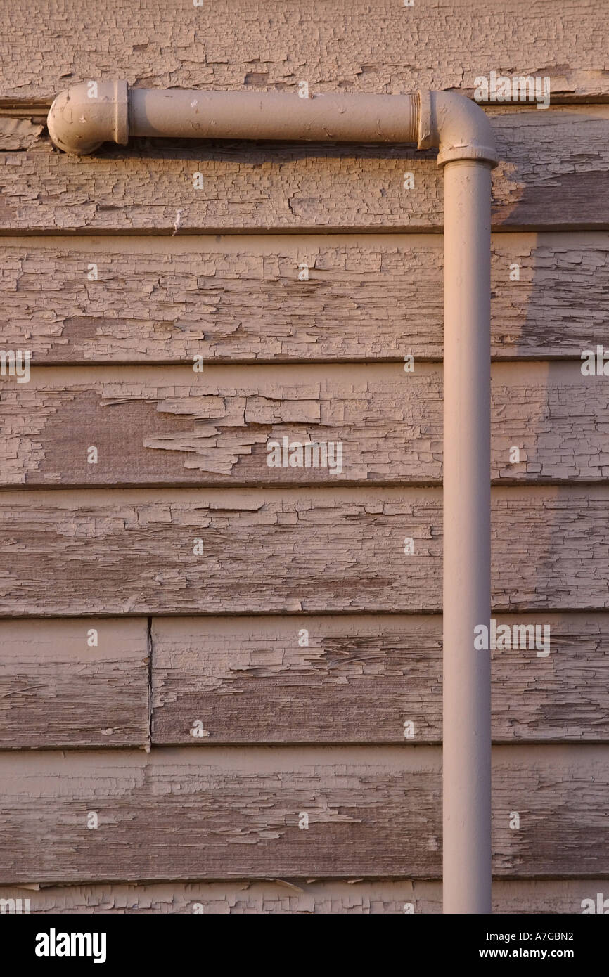 Electric conduit entering old house Stock Photo - Alamy