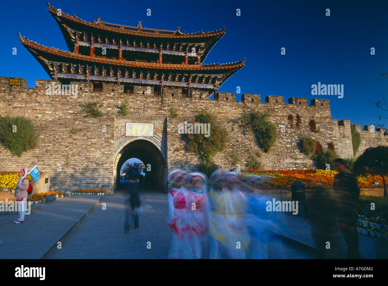 South gate with traditional Chinese women Dali Yunnan Province China ...