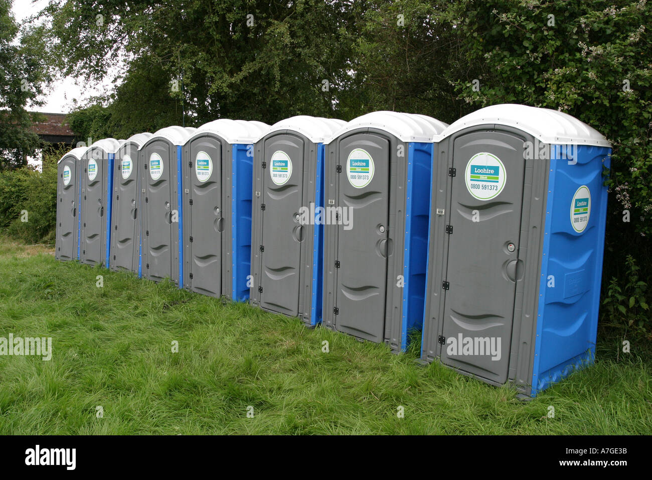 Row of toilet cubicles at public event Stock Photo - Alamy