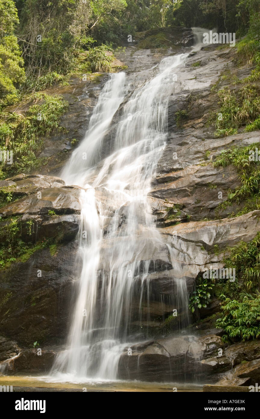 A waterfall in the Tijuca National Park in Rio De Janeiro with a slow ...