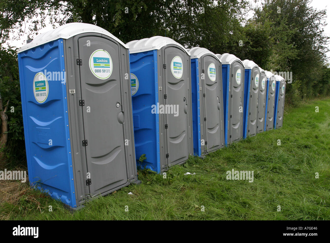 Row of toilet cubicles at public event Stock Photo - Alamy