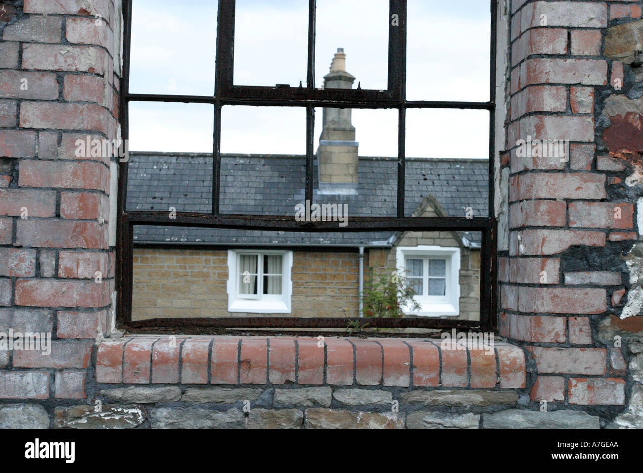 Windows of a railway workers cottage viewed through the windows of a ...