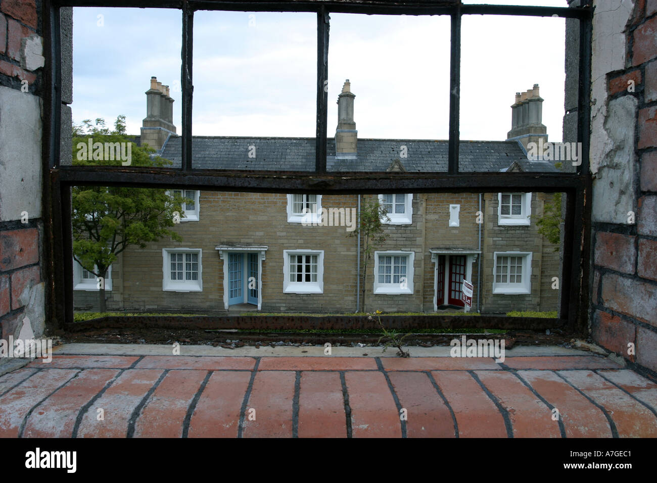 Windows of a railway workers cottage viewed through the windows of a ...