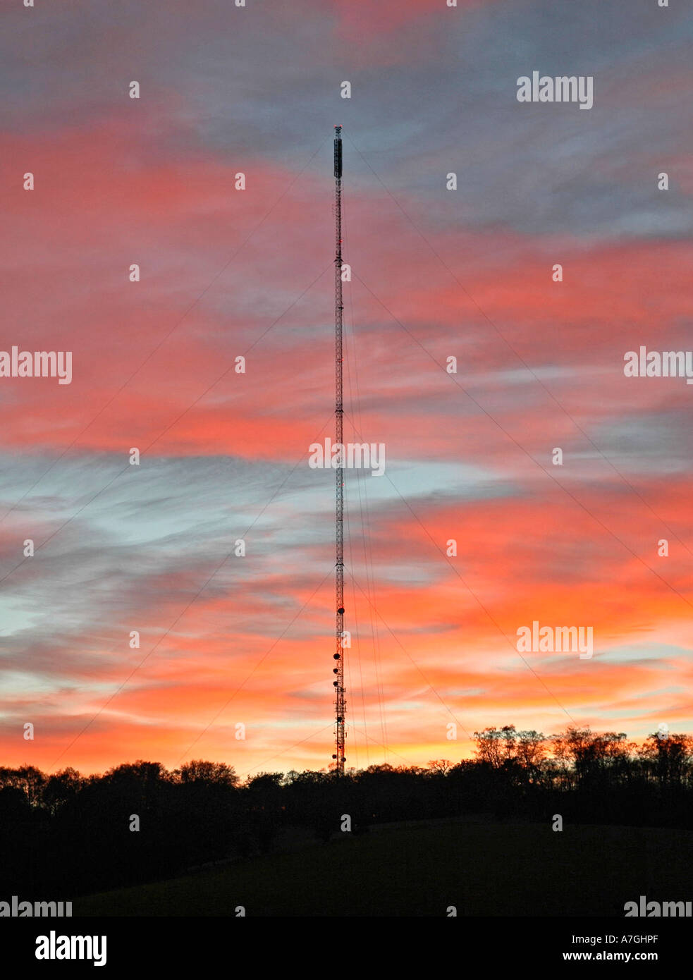 Hints television mast, against red sky, Lichfield, Staffordshire, UK ...