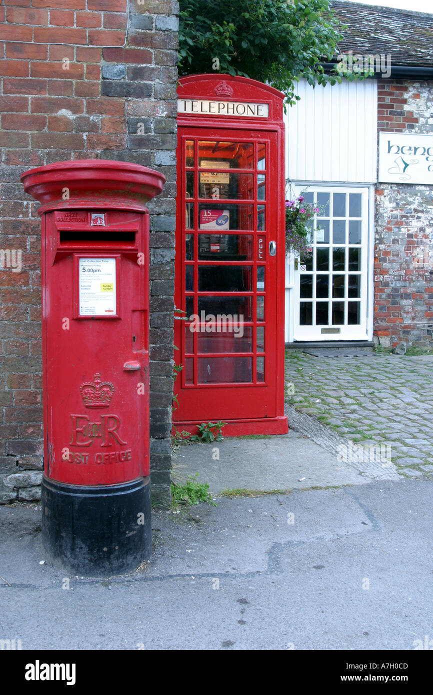 Red telephone kiosk pillar box and post office in the village of ...