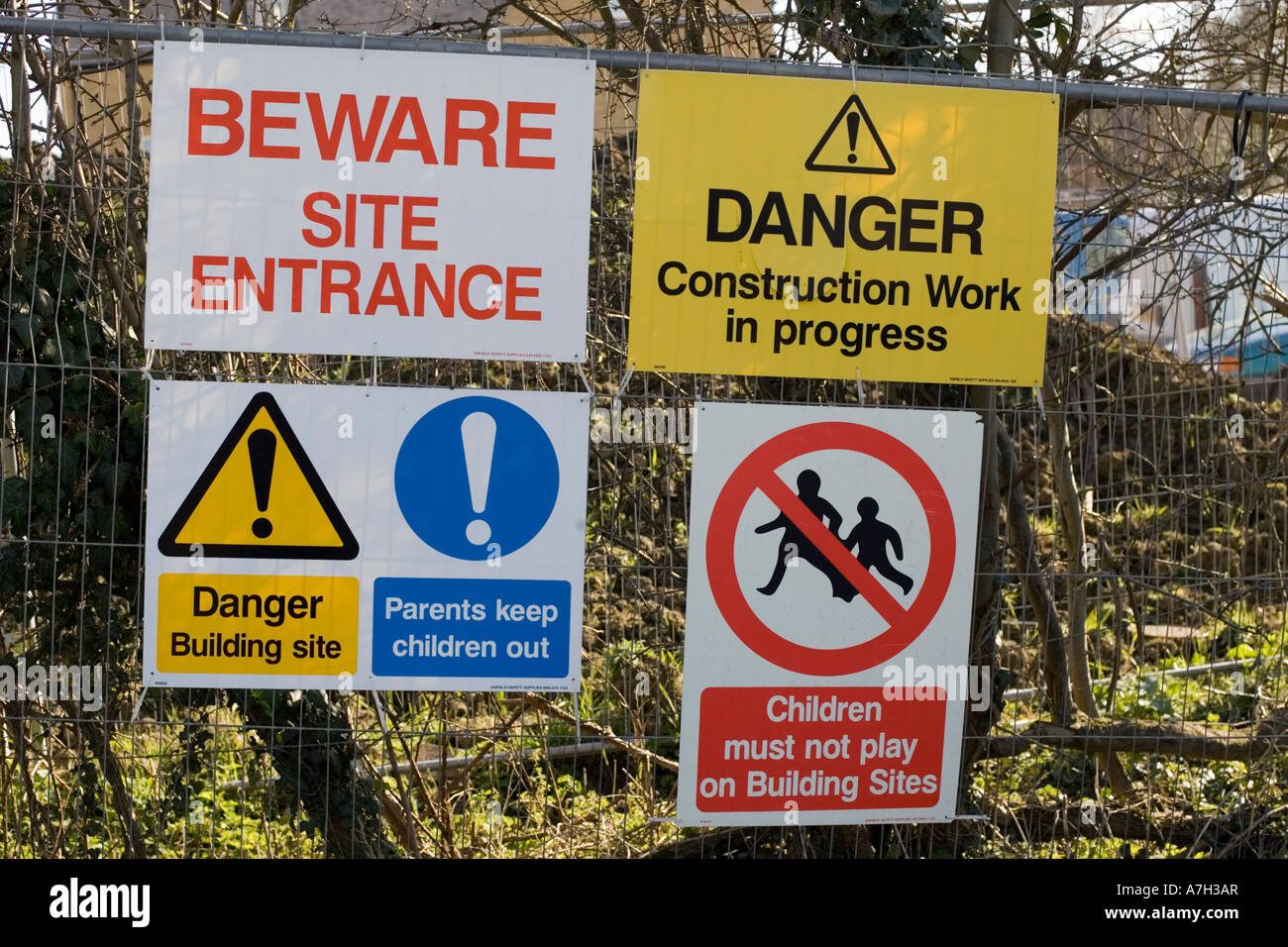 Warning notices outside building site Cotswolds UK Stock Photo - Alamy
