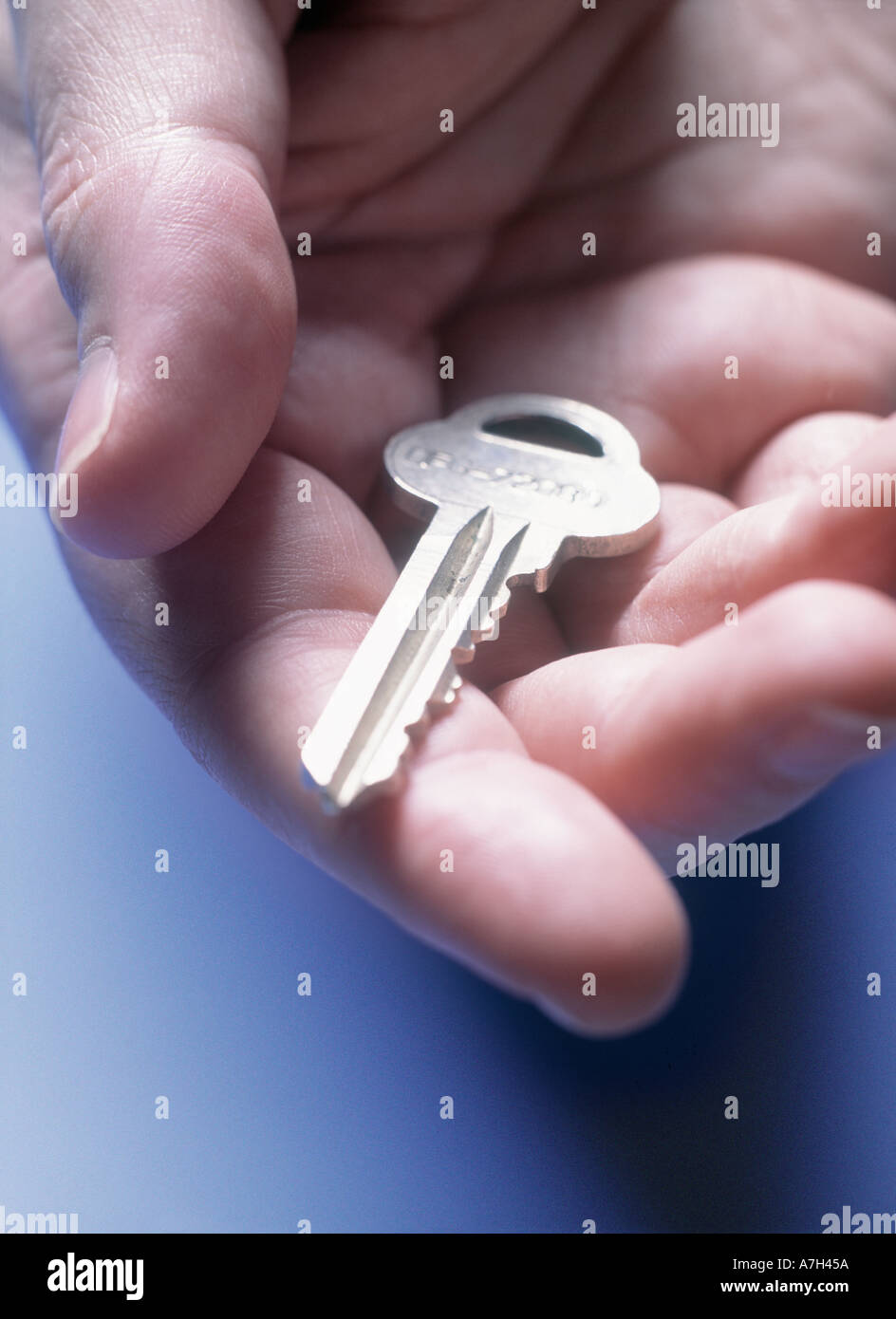 HAND WITH A KEY Stock Photo - Alamy