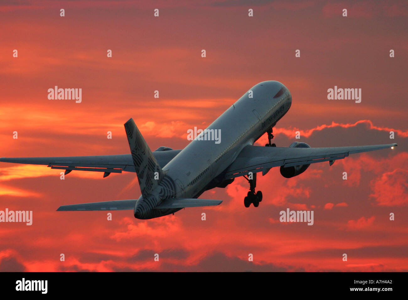 British Airways commercial airplane Boeing 757 and dramatic red sunset ...